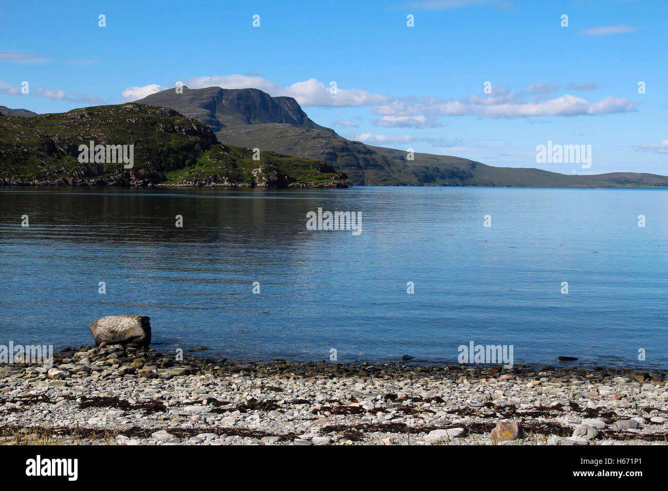 Rocky and stony beach at the campsite on Ardmair Point, near Ullapool ...