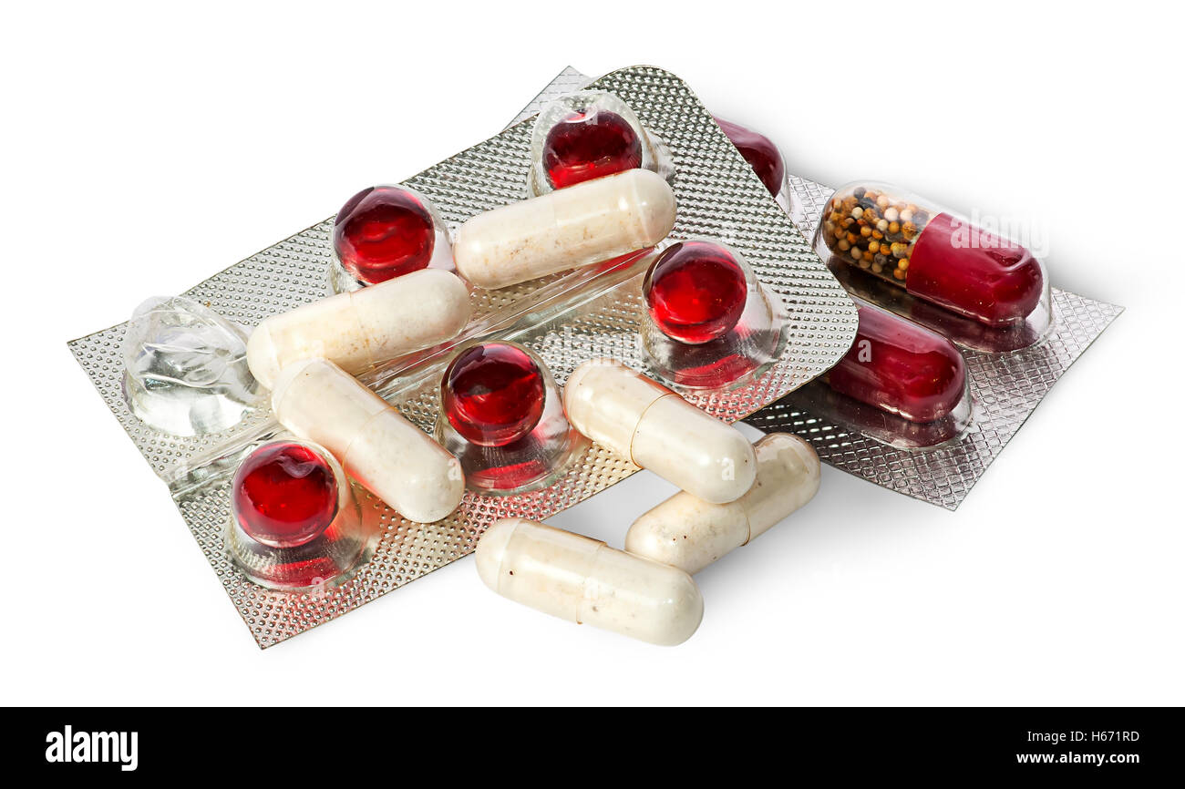 Heap of pills and capsules in package isolated on white background ...