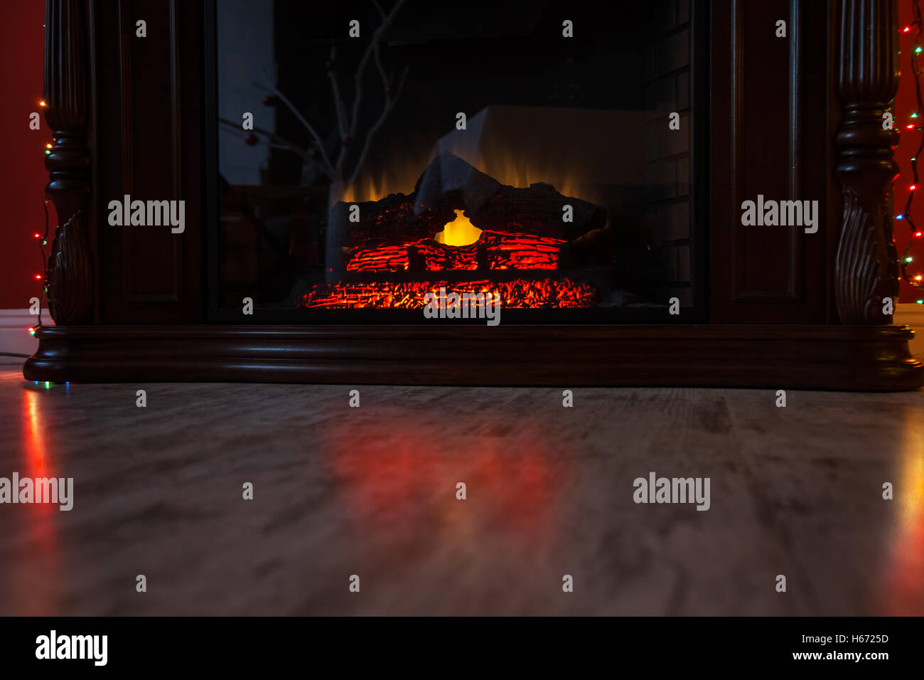 Dark room with fire in fireplace in christmas night Stock Photo - Alamy