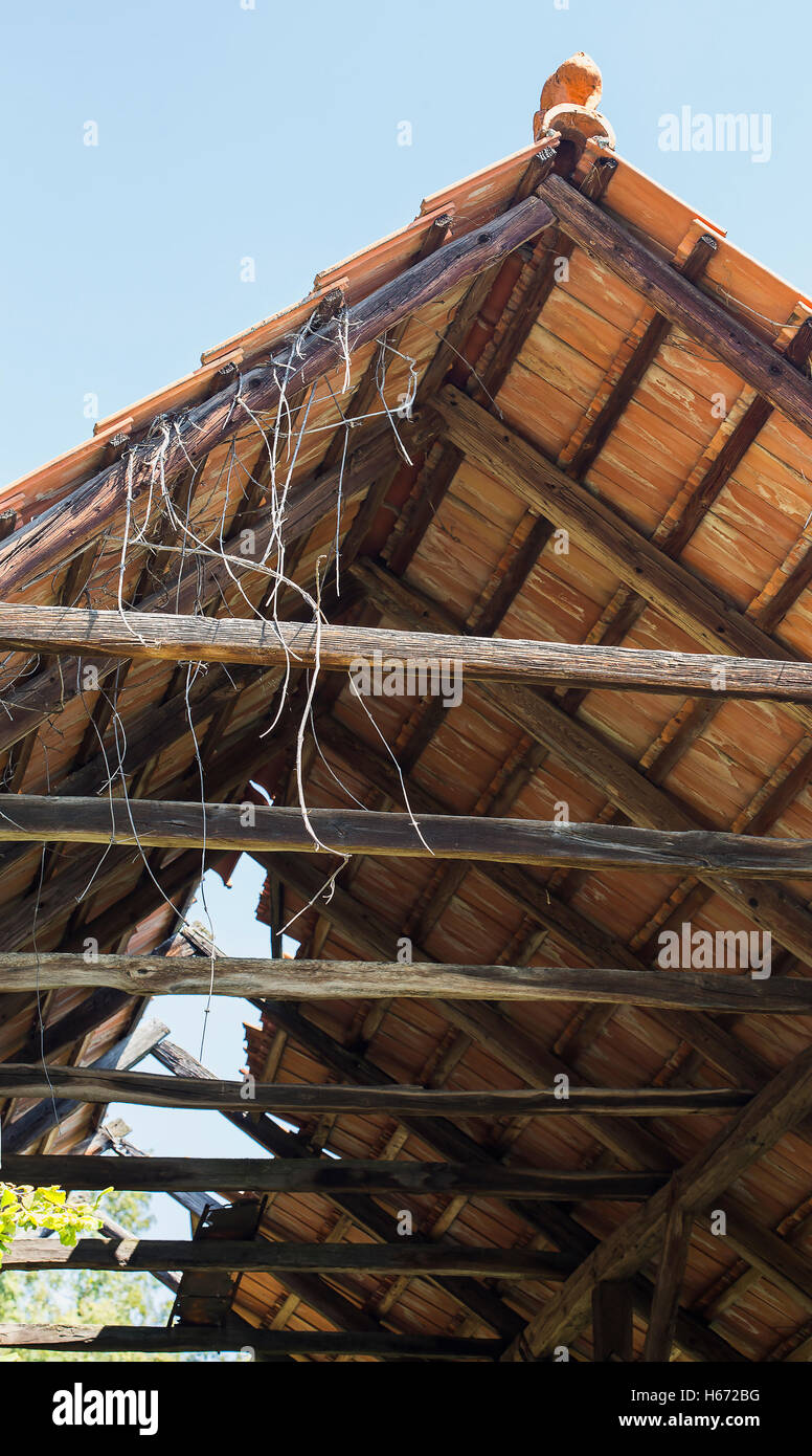 Demolished wooden building that needs roof repairment Stock Photo - Alamy