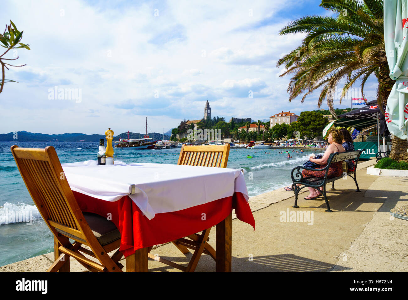 LOPUD, CROATIA - JUNE 27, 2015: Scene of the fishing port and the beach ...