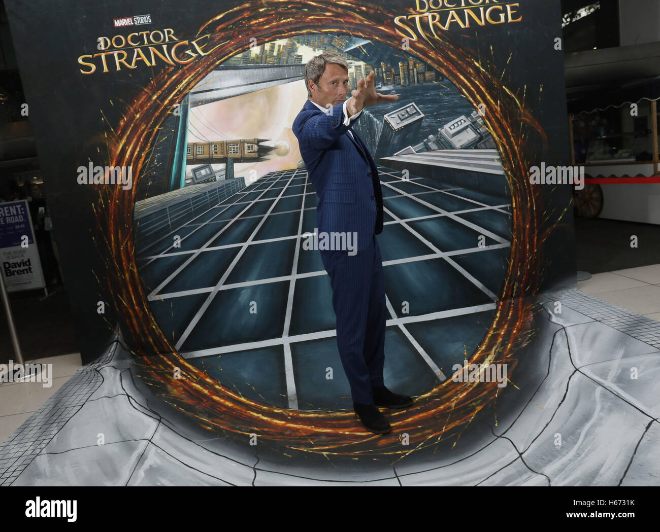 Mads Mikkelson poses in front of a Dr Strange-inspired 3D portal ...