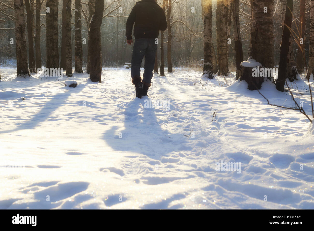 Young man walking through snowstorm hi-res stock photography and images ...