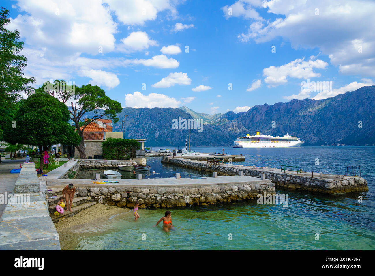 PRCANJ, MONTENEGRO - JUNE 29, 2015: Beach scene, with the Bay of Kotor ...