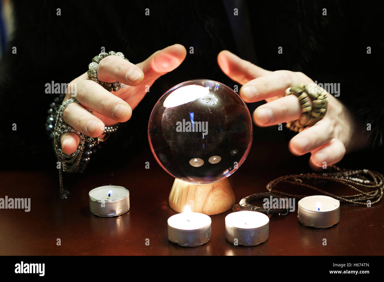 sorcerer hands over a transparent crystal ball fortune-telling for ...