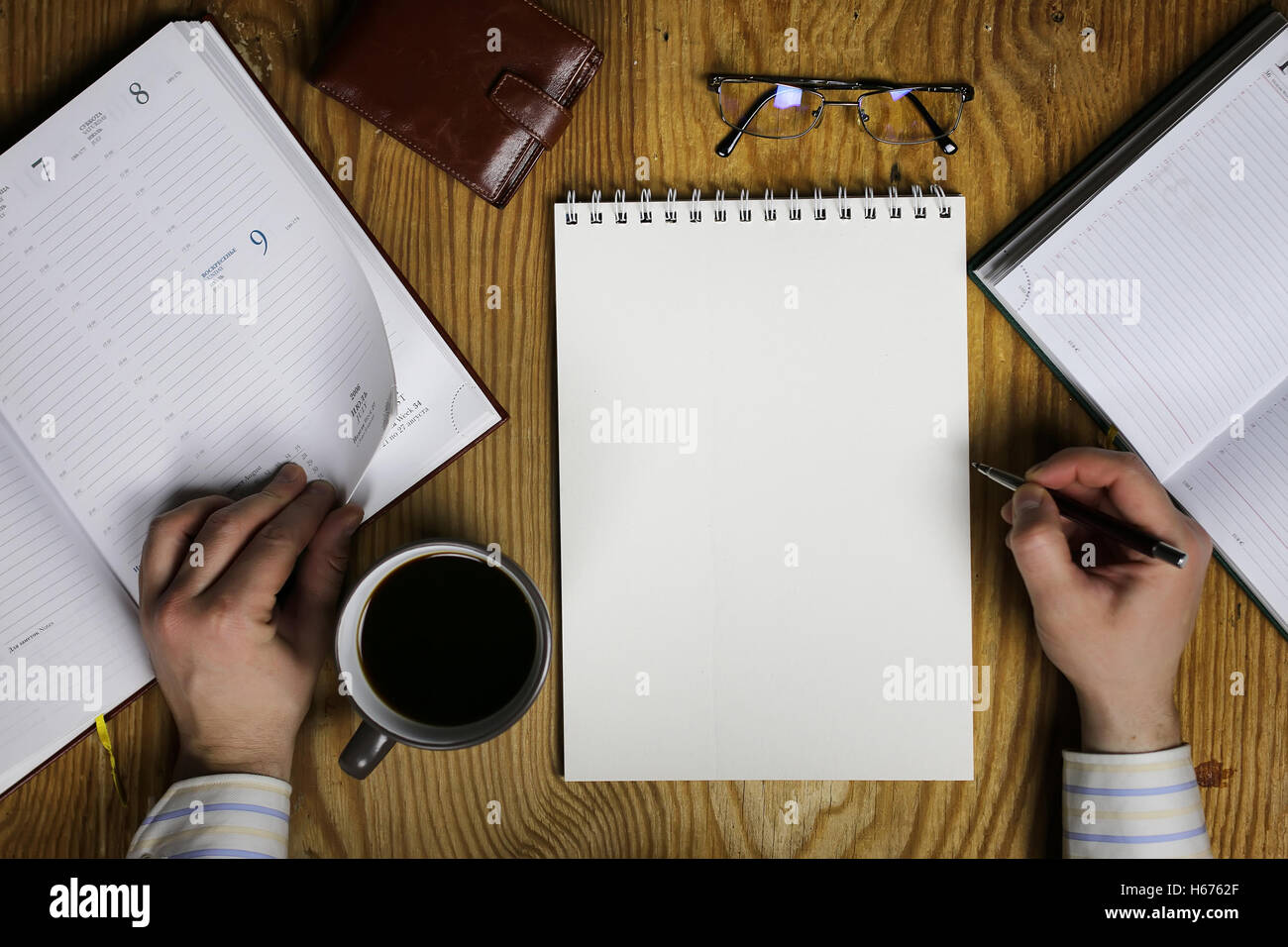 table write hand office view Stock Photo - Alamy