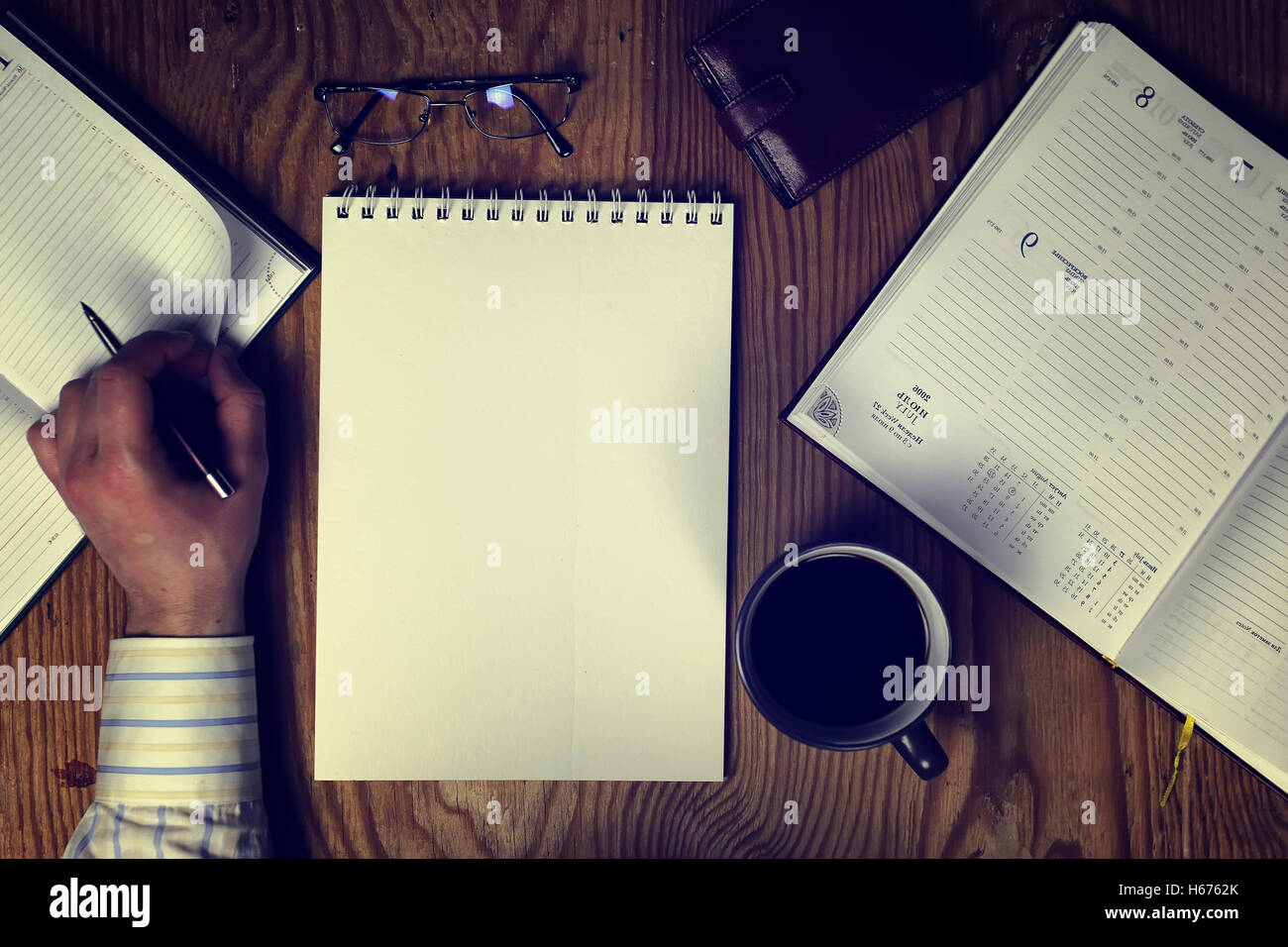 toned table write hand top view Stock Photo - Alamy