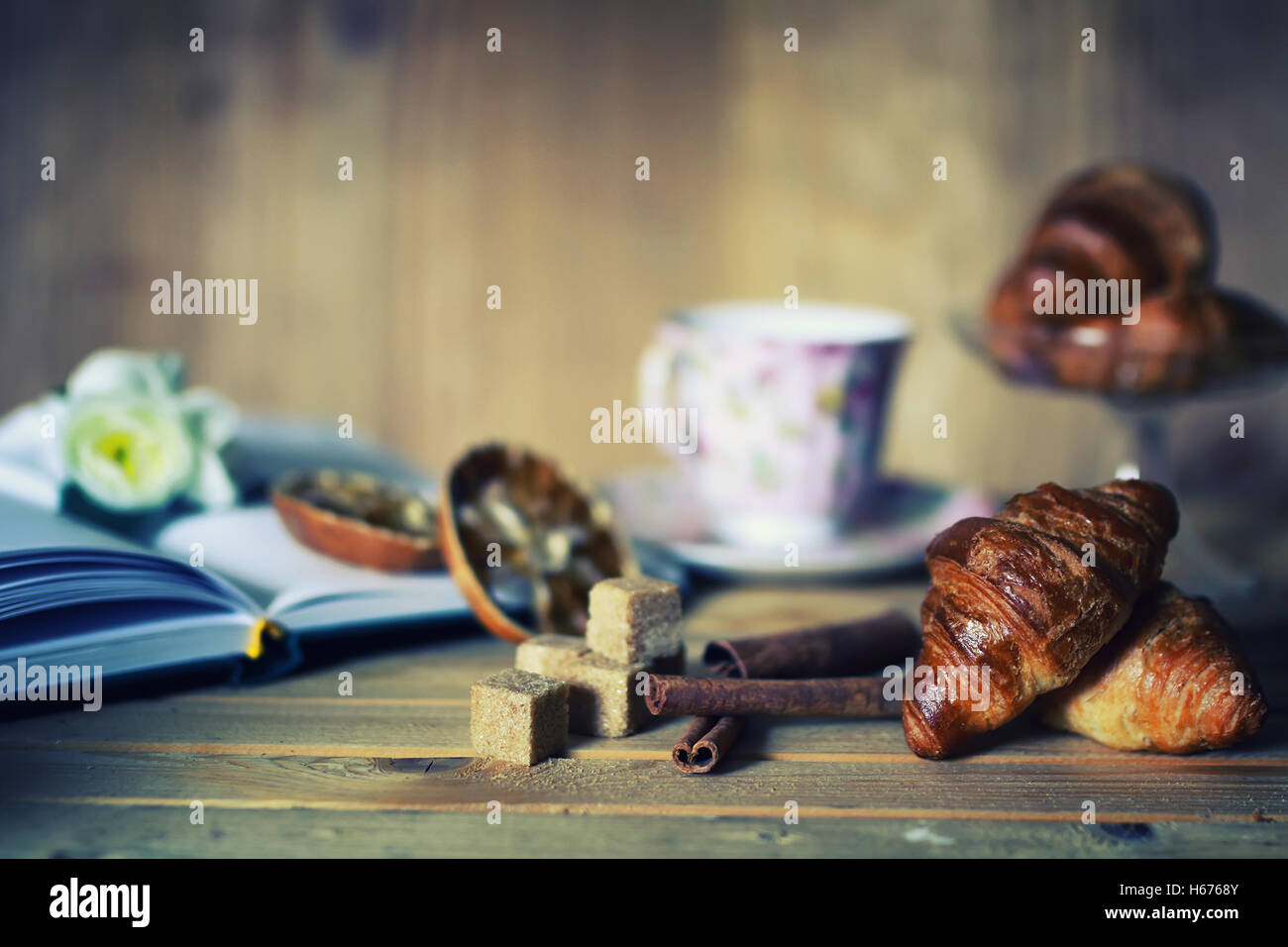 tea cup croissant book Stock Photo - Alamy