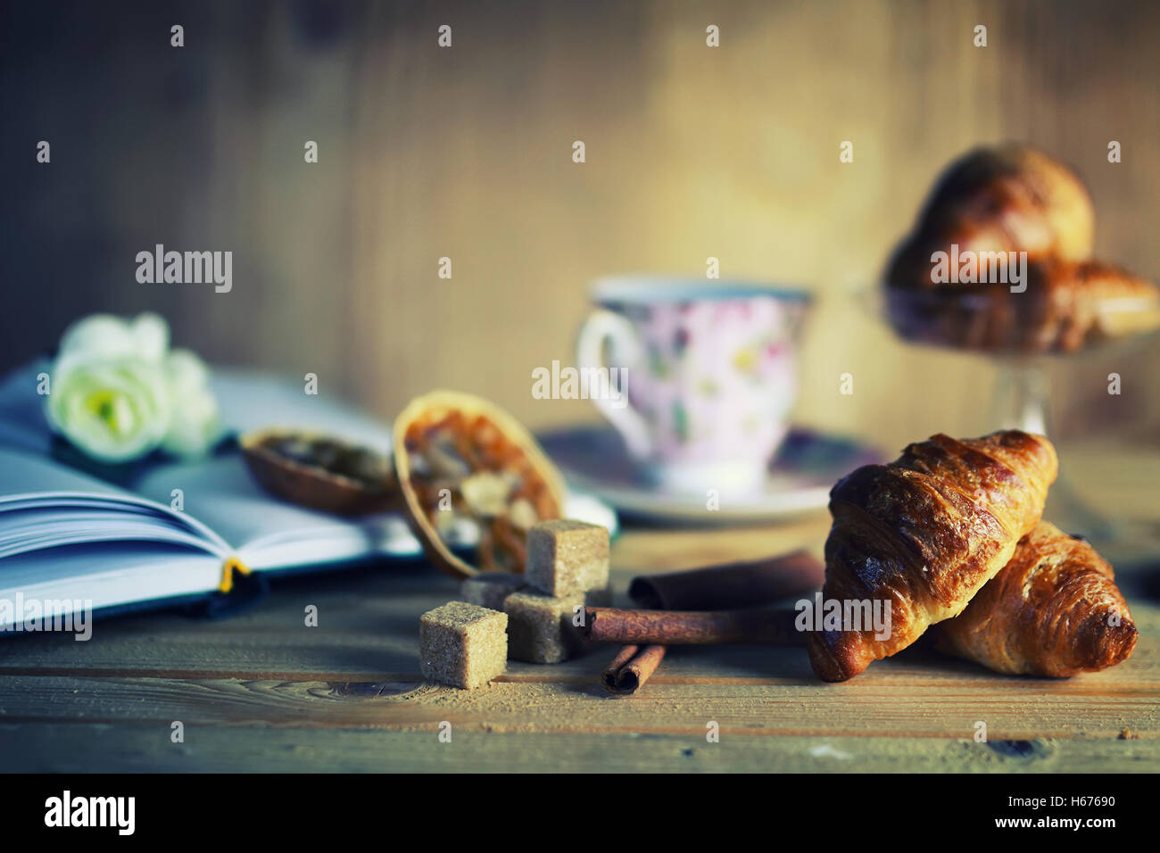 tea cup croissant book Stock Photo - Alamy