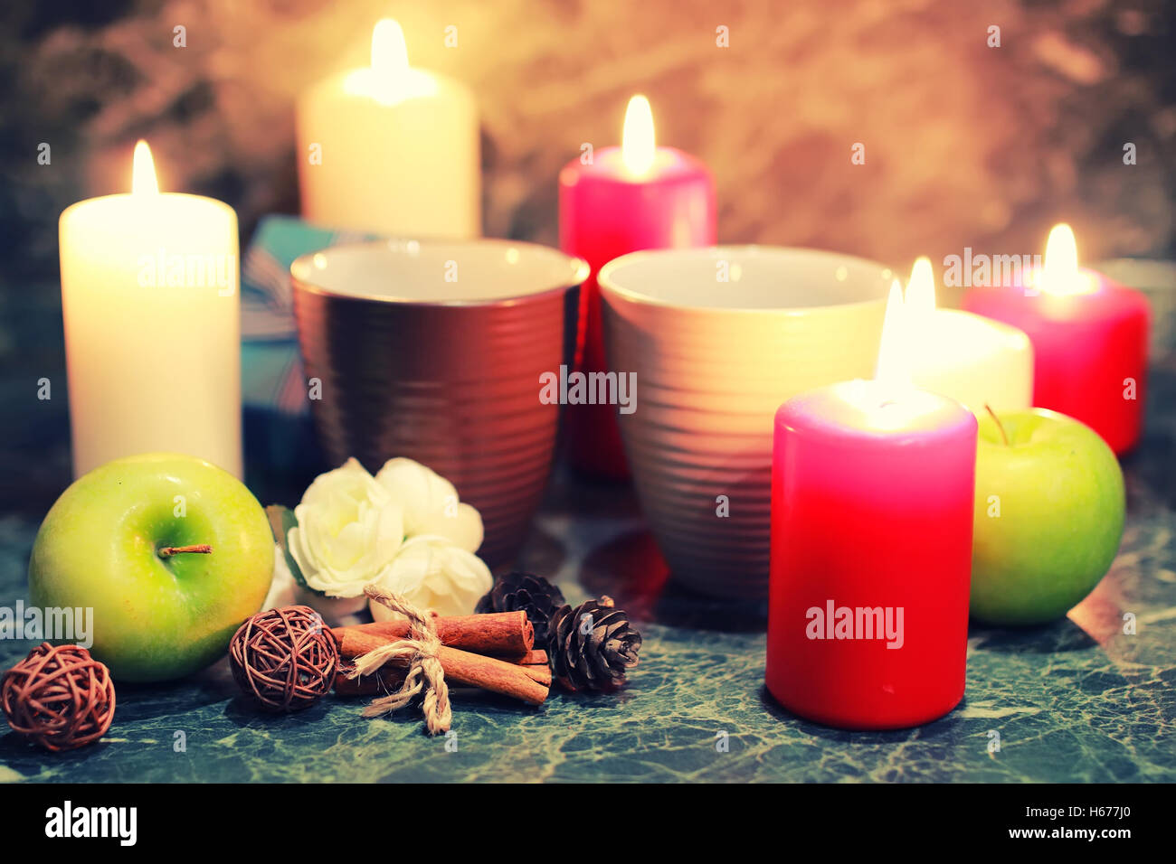 night table with mug and candle Stock Photo - Alamy