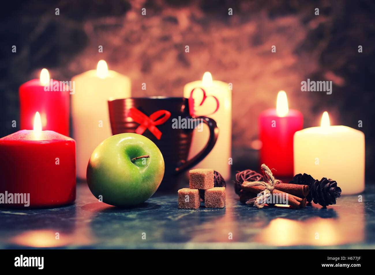 night table with mug and candle Stock Photo - Alamy