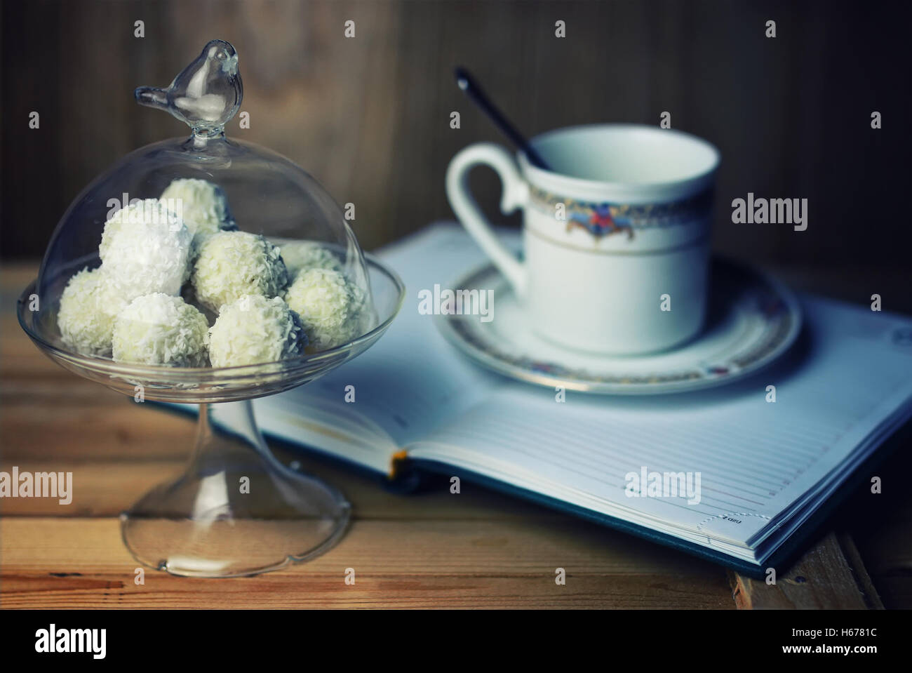 reading book with tea flower and sweet Stock Photo - Alamy