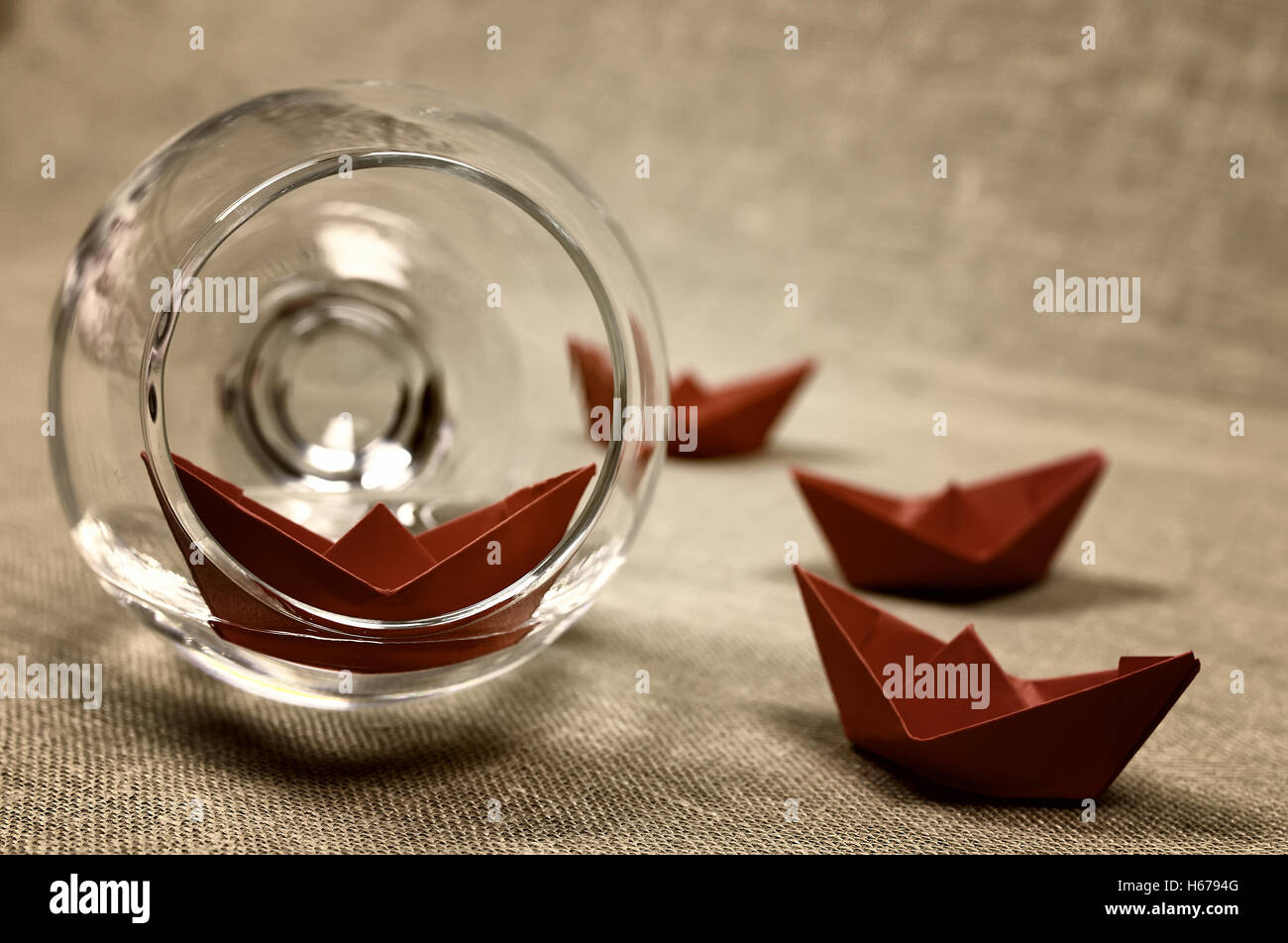 toned colored paper boats glass Stock Photo - Alamy