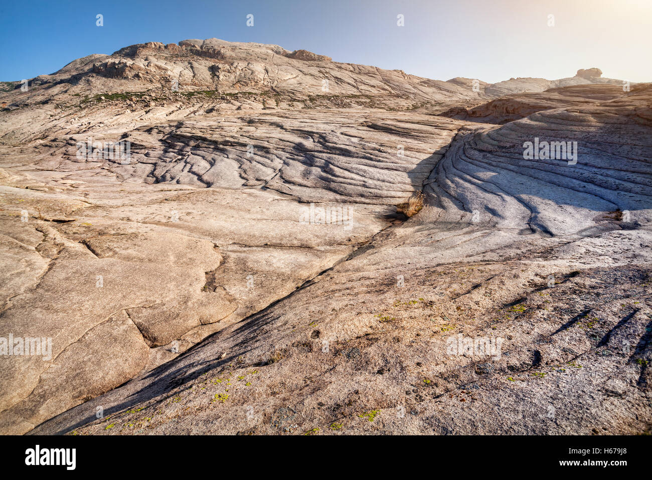 Extinct volcano Bektau Ata in the desert at beautidul sunset of eastern ...