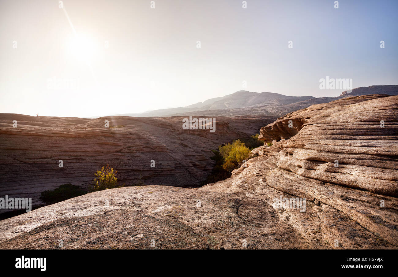 Layered volcanic canyon in the desert with mountains at beautiful ...