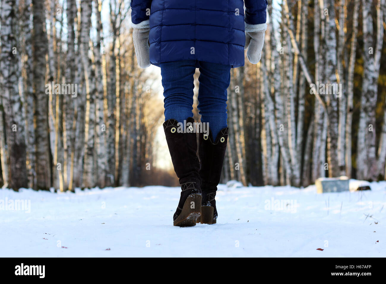 woman walk park winter snow back Stock Photo - Alamy