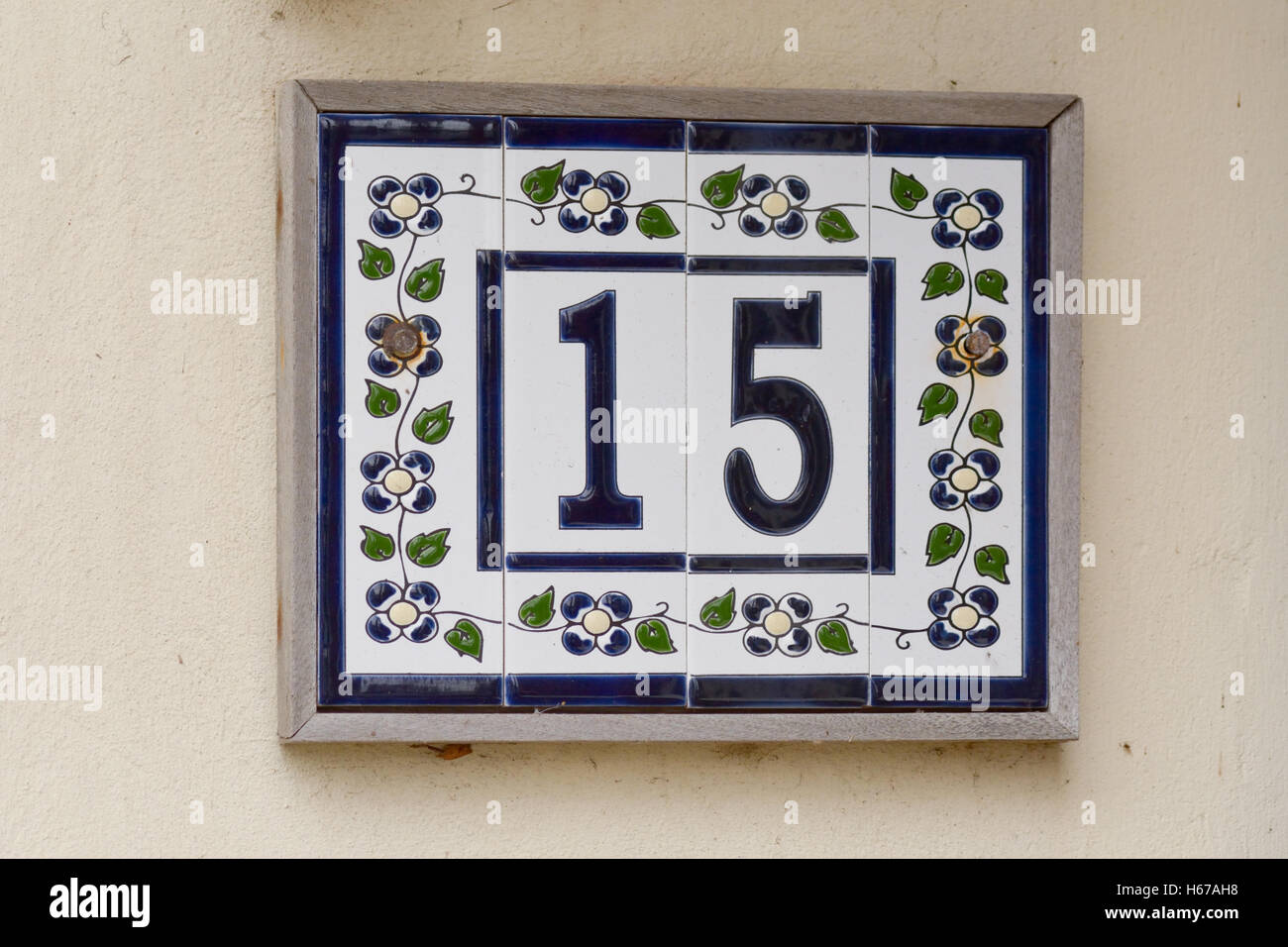 House number 15 sign - ceramic tile with pattern Stock Photo - Alamy