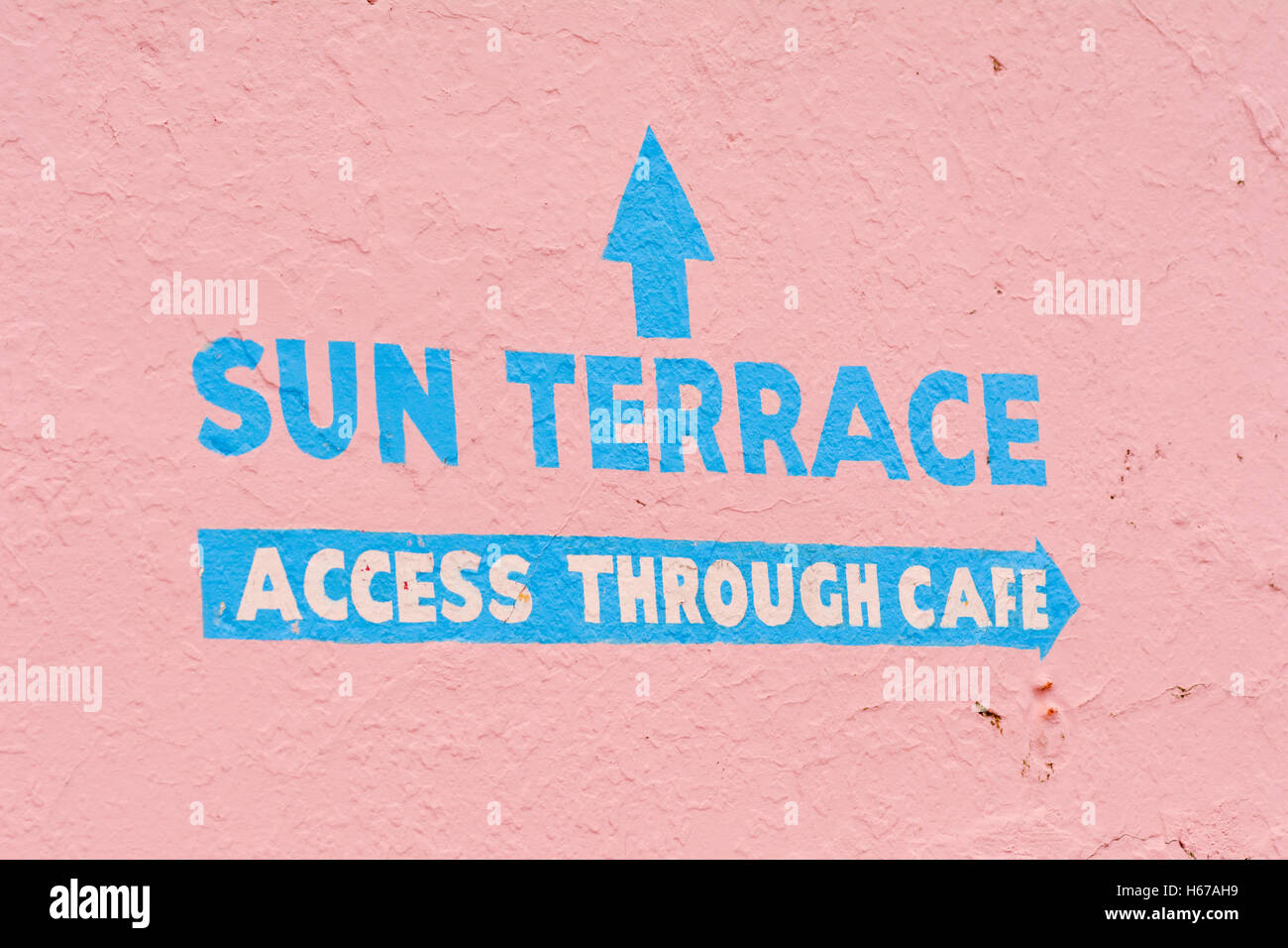 Sun Terrace sign at cafe with direction arrows Stock Photo - Alamy