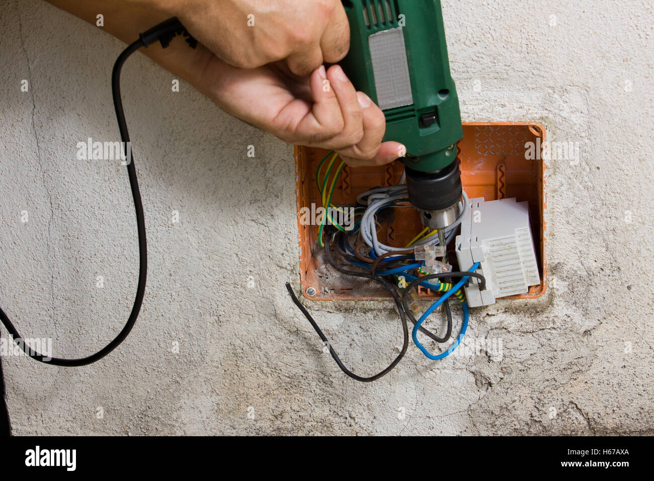 electrician at work in a building site Stock Photo - Alamy