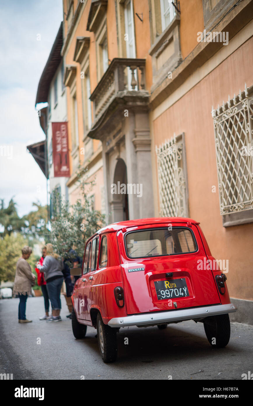 red Renault 4 in the street of the Volterra, Tuscany, Italy, EU, Europe ...