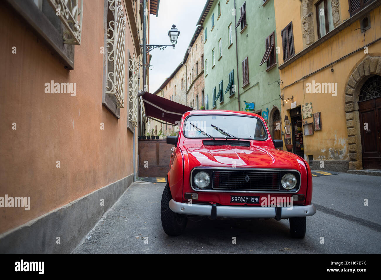 red Renault 4 in the street of the Volterra, Tuscany, Italy, EU, Europe ...