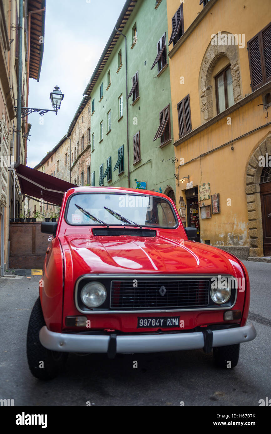 red Renault 4 in the street of the Volterra, Tuscany, Italy, EU, Europe ...