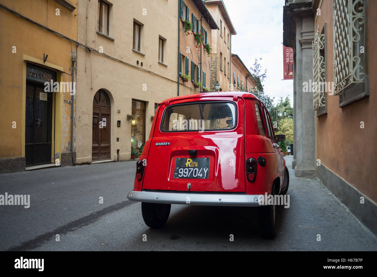 red Renault 4 in the street of the Volterra, Tuscany, Italy, EU, Europe ...