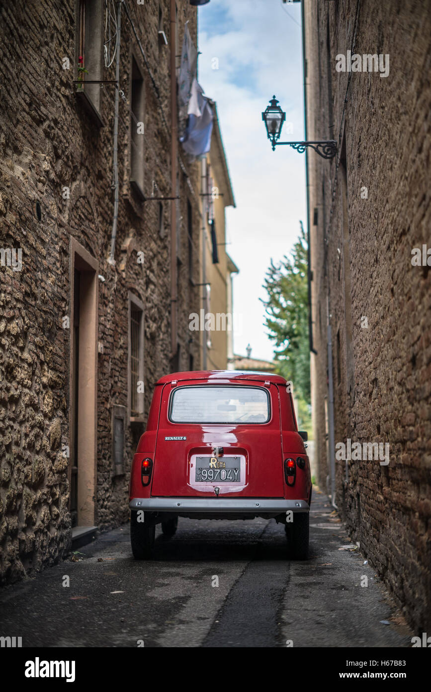 red Renault 4 in the street of the Volterra, Tuscany, Italy, EU, Europe ...