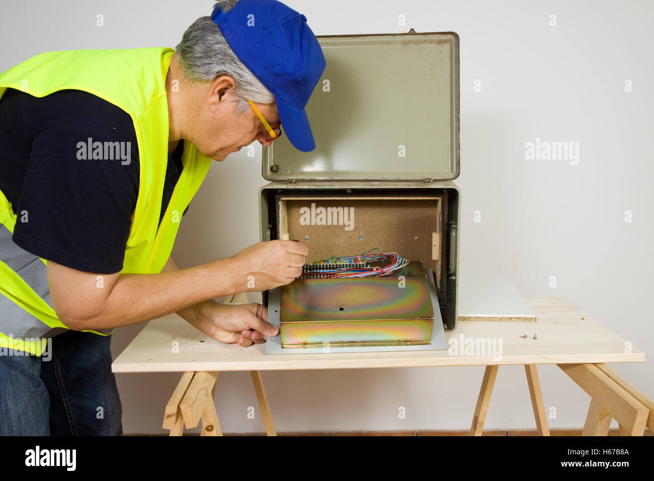 electrician at work with an electronic device Stock Photo - Alamy