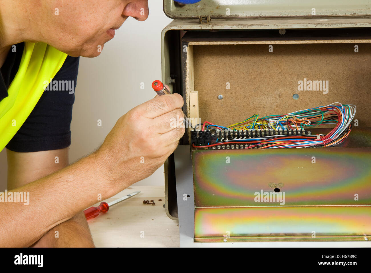 electrician at work with an electronic device Stock Photo - Alamy