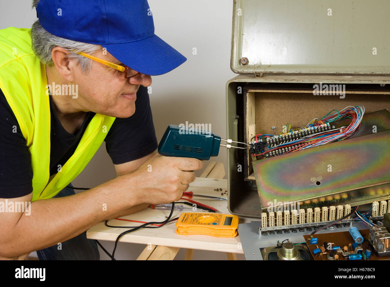 electrician at work with an electronic device Stock Photo - Alamy
