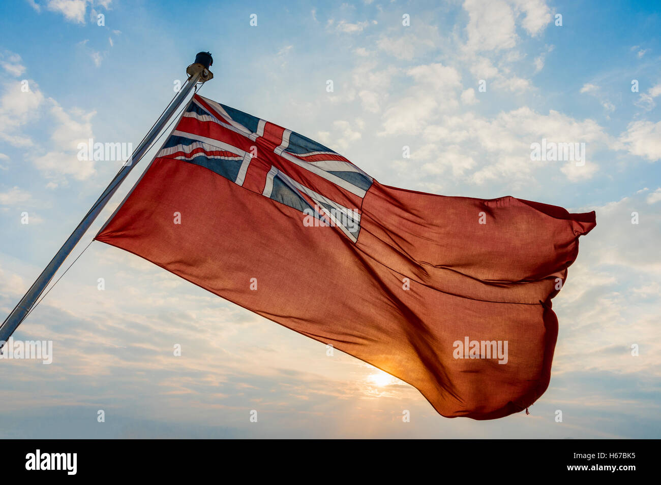 The "Red Ensign" flag flying on the RMS Queen Mary 2 shortly before ...