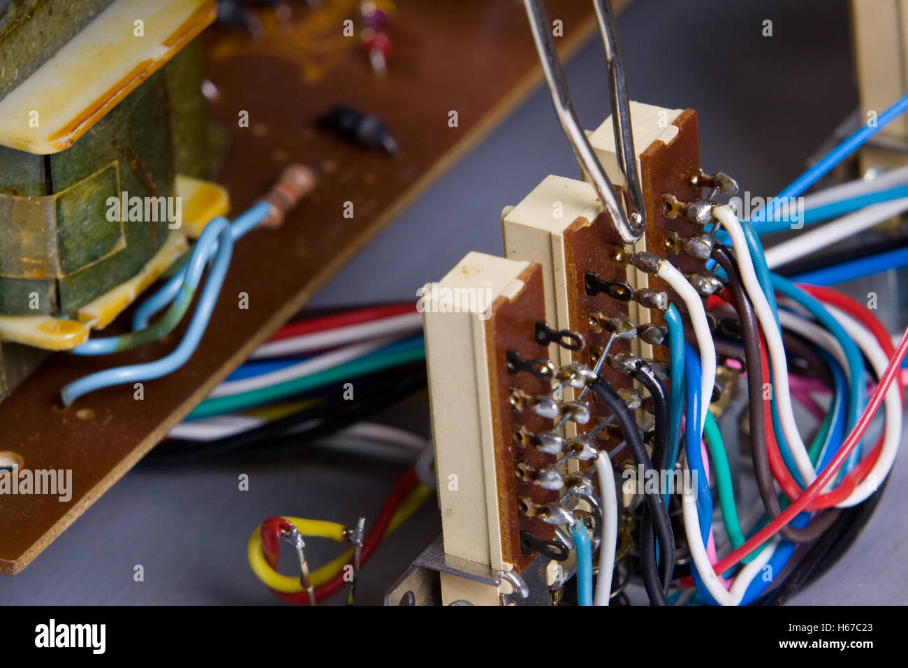 electrician at work with an electric device Stock Photo - Alamy