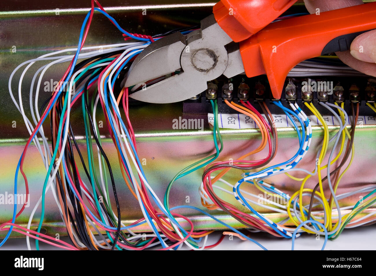 electrician at work with an electric device Stock Photo - Alamy