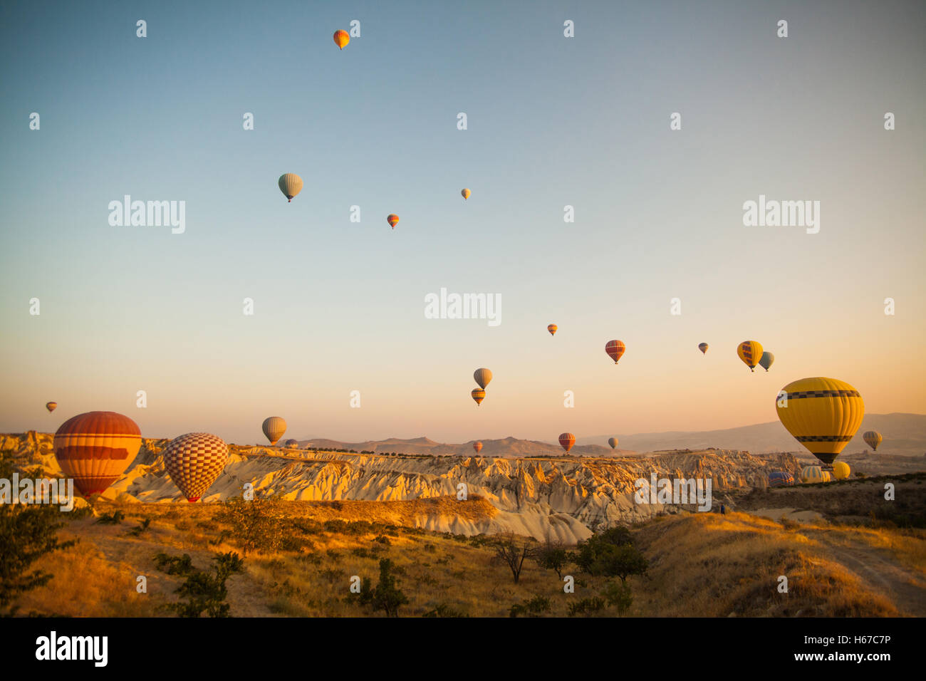 Color image of hot air balloons flying in Cappadocia, Turkey, at sunrise Stock Photo - Alamy