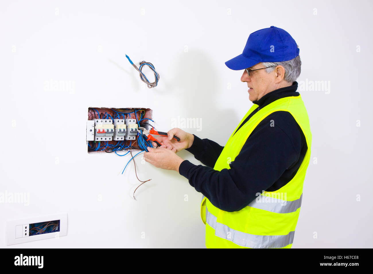 electrician at work in a building site Stock Photo - Alamy