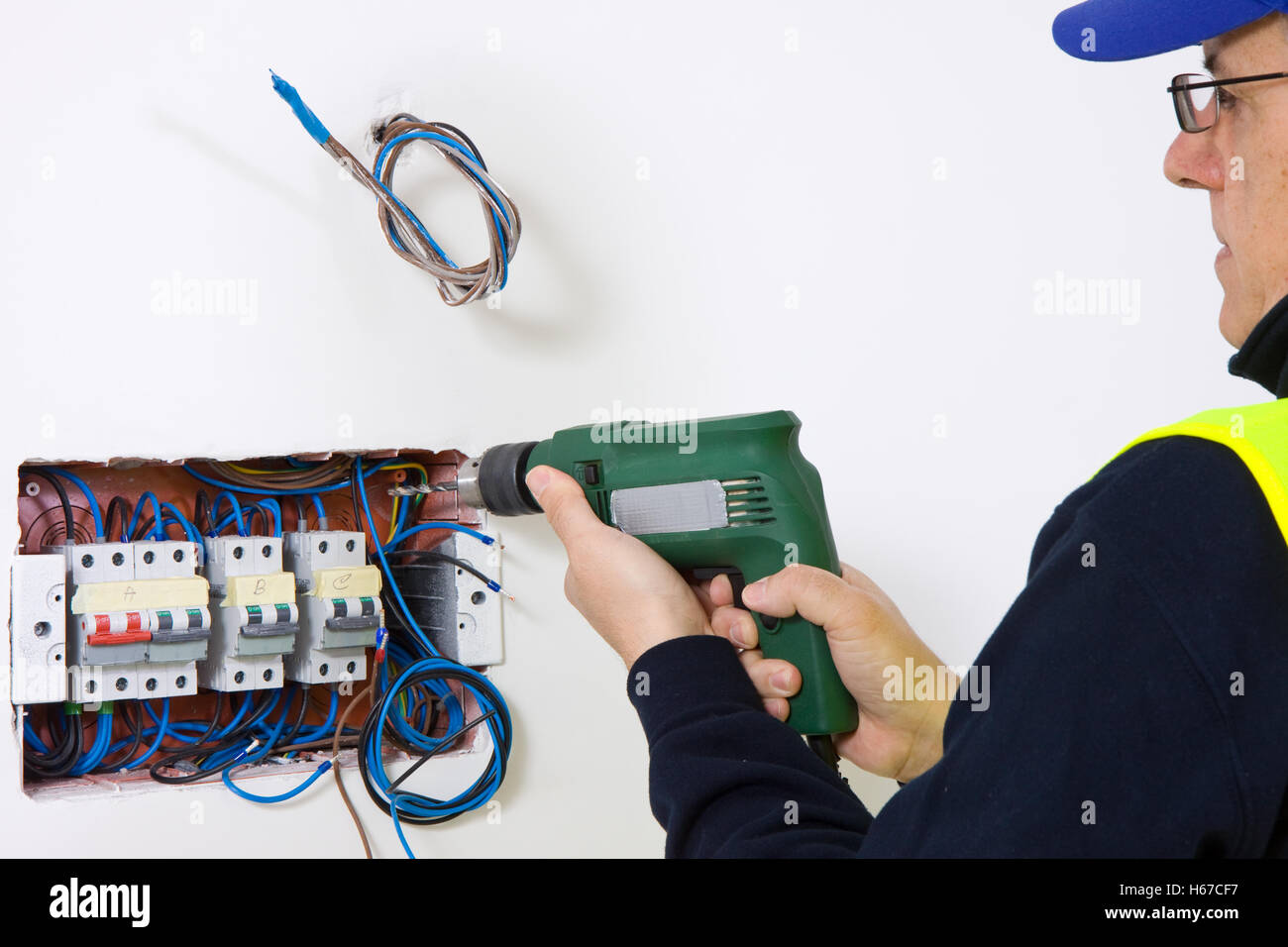 electrician at work in a building site Stock Photo - Alamy