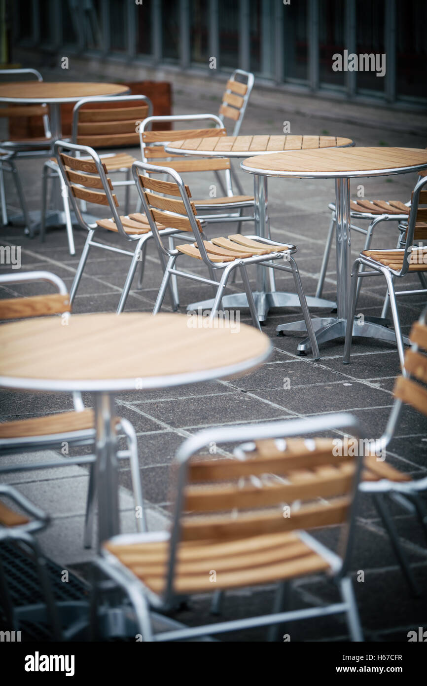 Color image of some wooden chairs and tables on a terrace Stock Photo ...