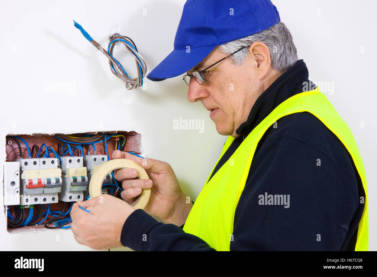 electrician at work in a building site Stock Photo - Alamy