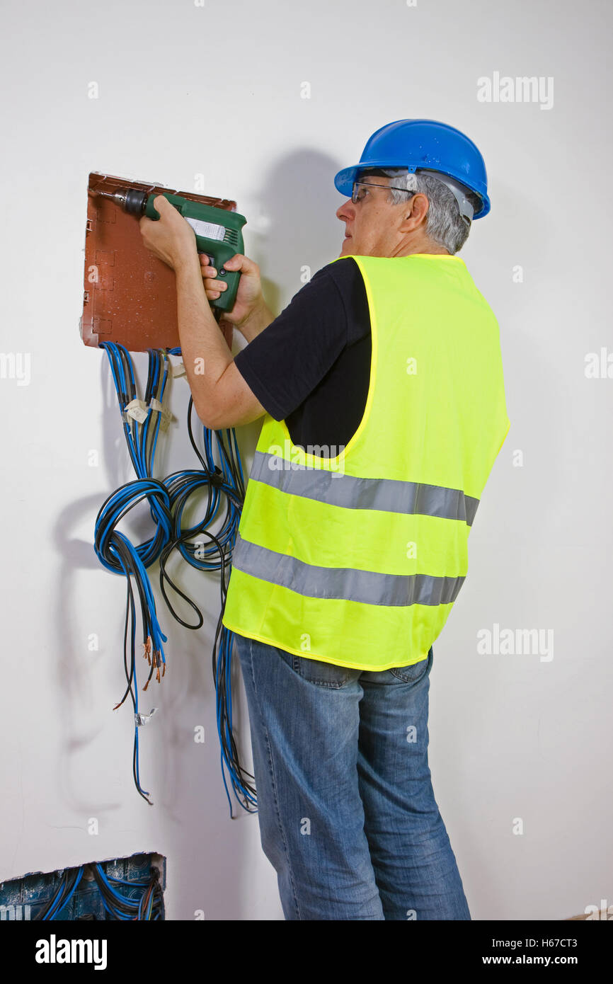 electrician at work in a building site Stock Photo - Alamy