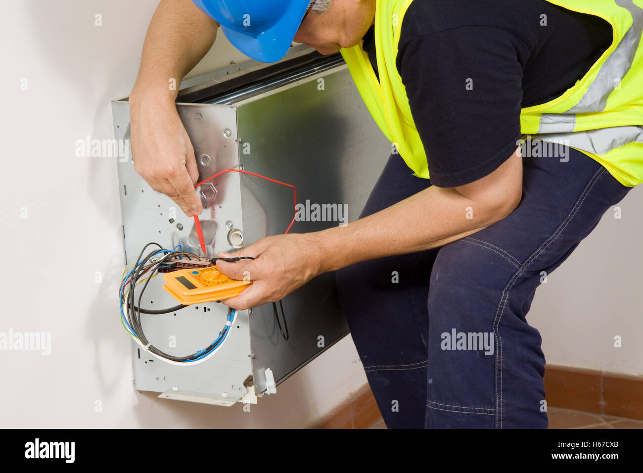 electrician at work in a building site Stock Photo - Alamy