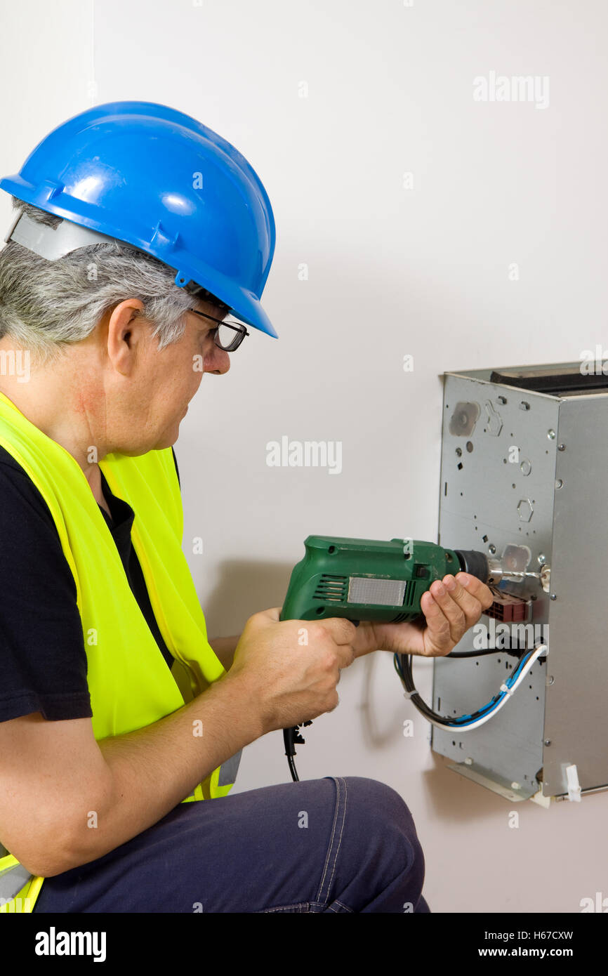 electrician at work in a building site Stock Photo - Alamy