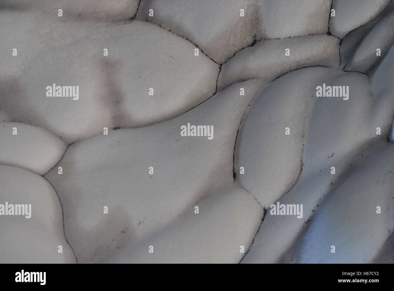Shapes in melting snow Stock Photo - Alamy
