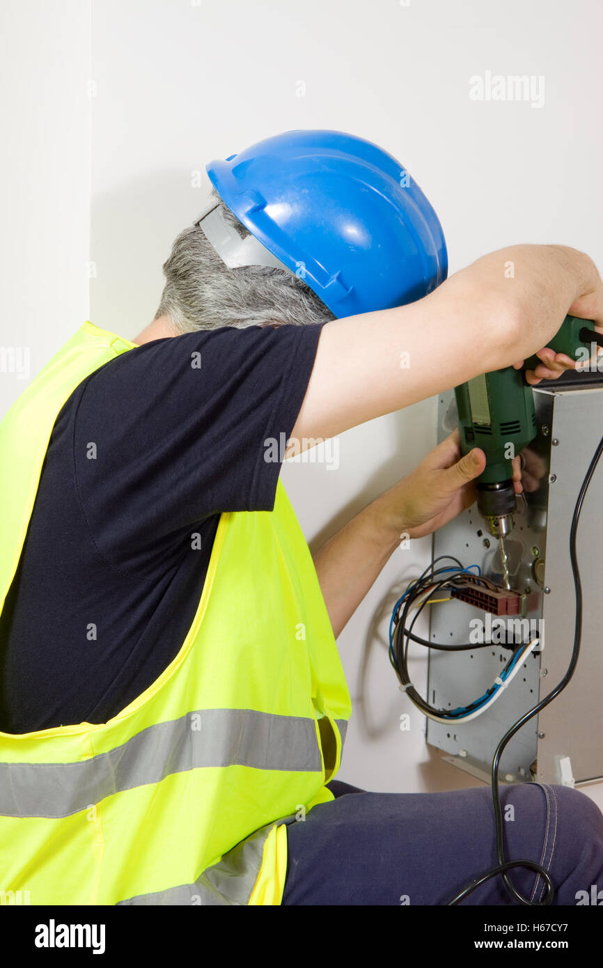 electrician at work in a building site Stock Photo - Alamy