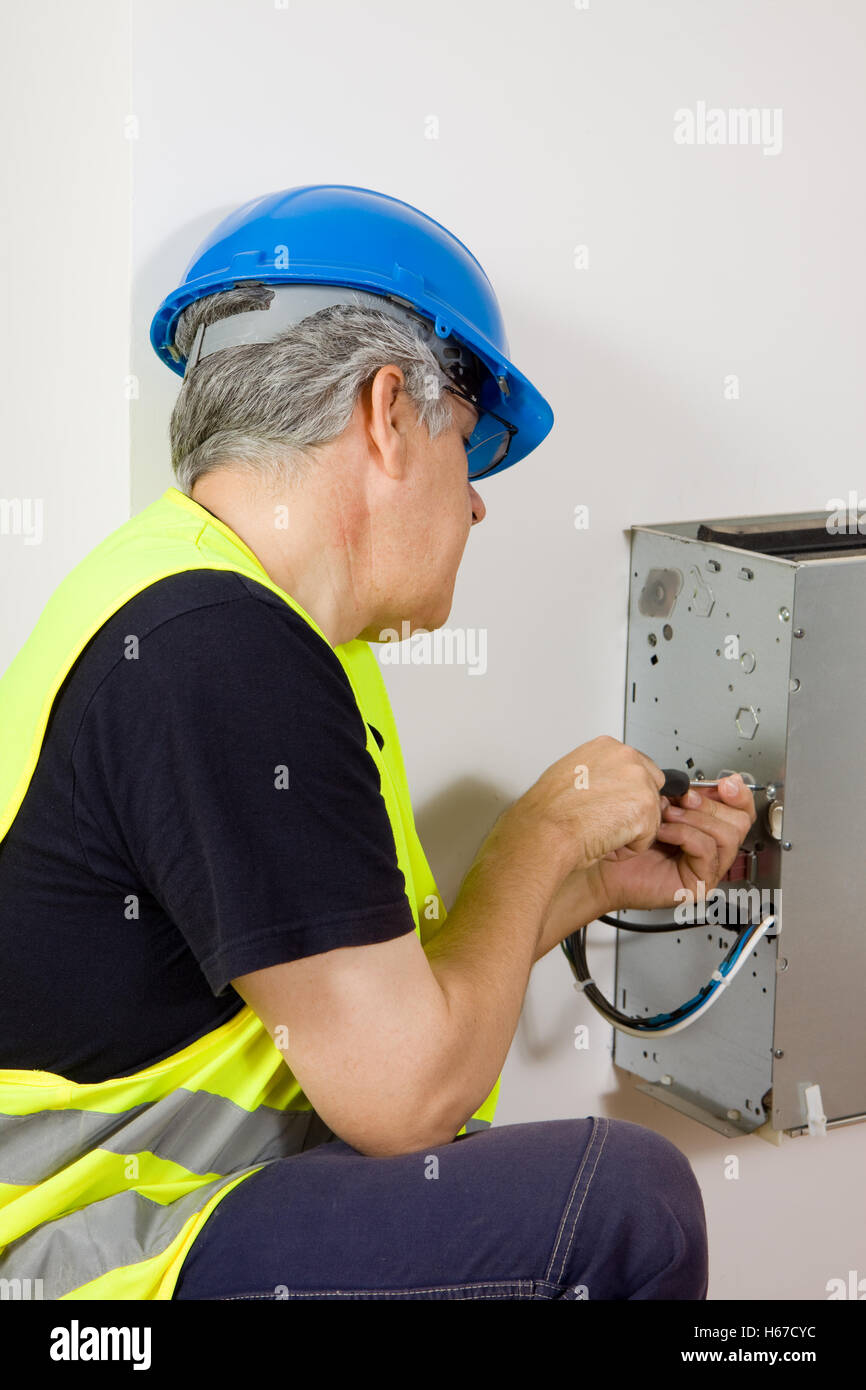 electrician at work in a building site Stock Photo - Alamy
