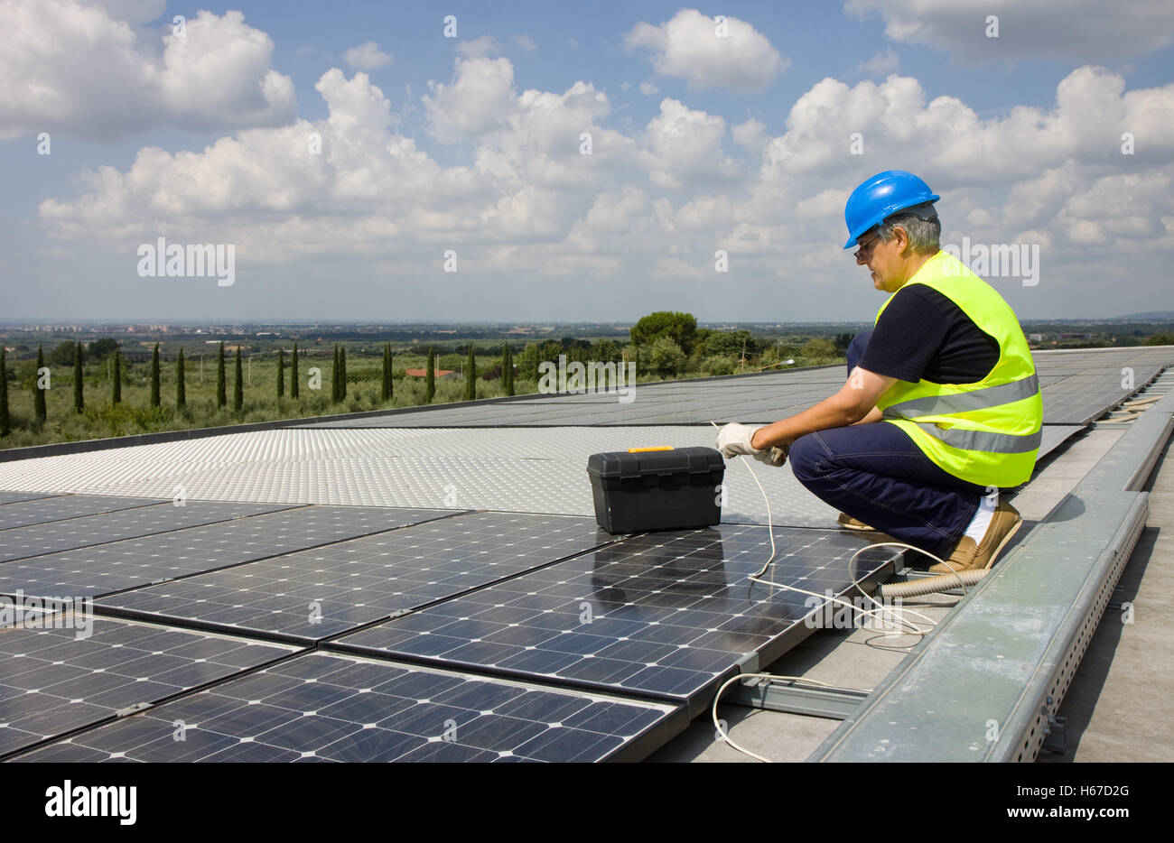 skilled worker fitting a photovoltaic plant on roof Stock Photo - Alamy