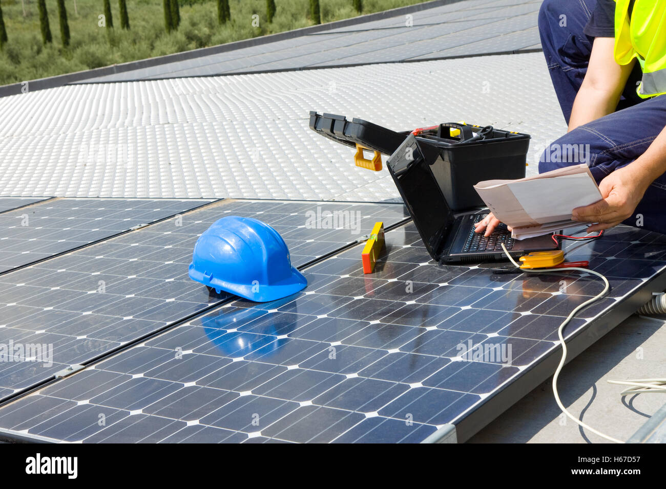 skilled worker fitting a photovoltaic plant on roof Stock Photo - Alamy
