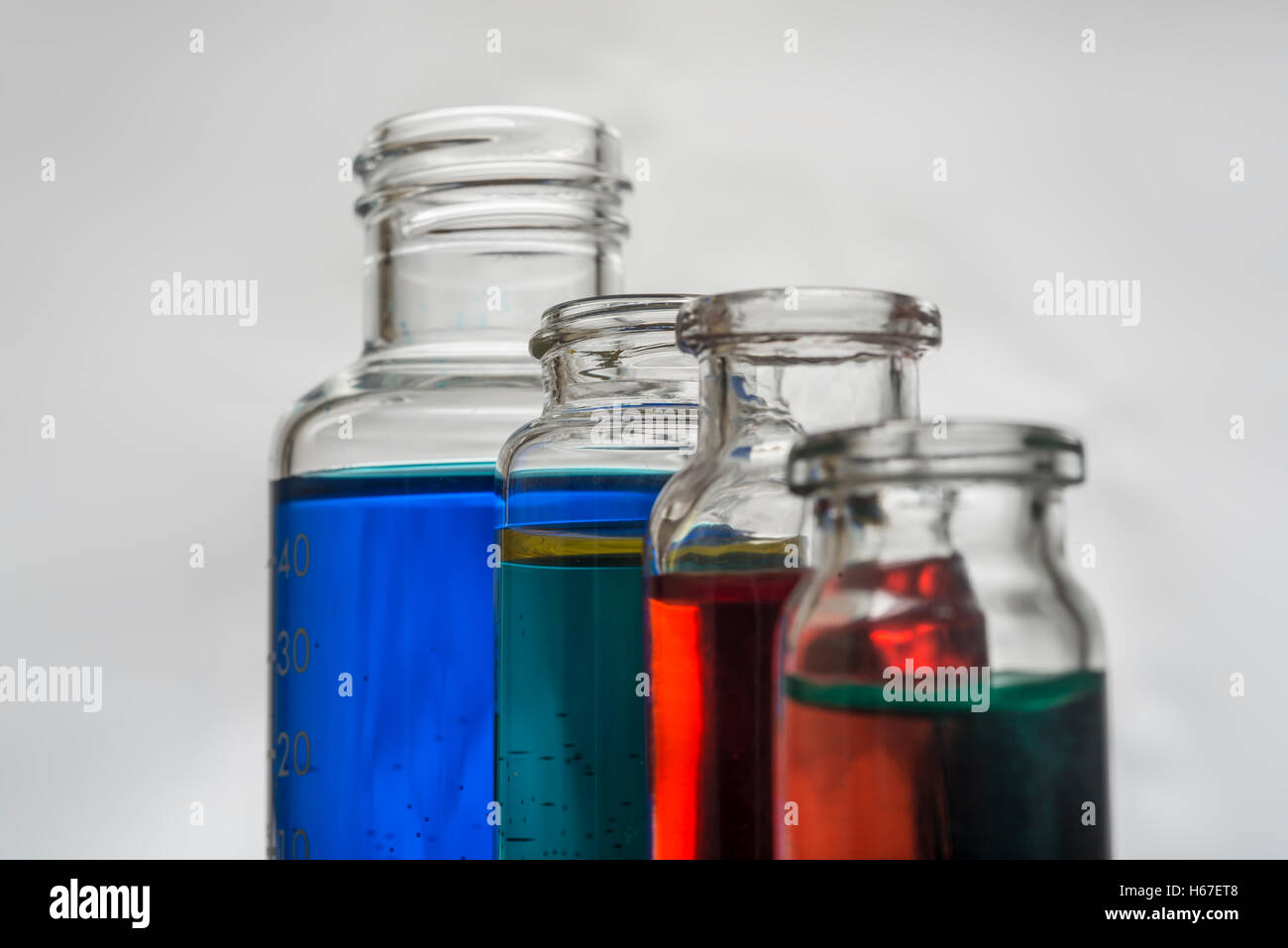 Set of laboratory bottles with color liquid Stock Photo - Alamy