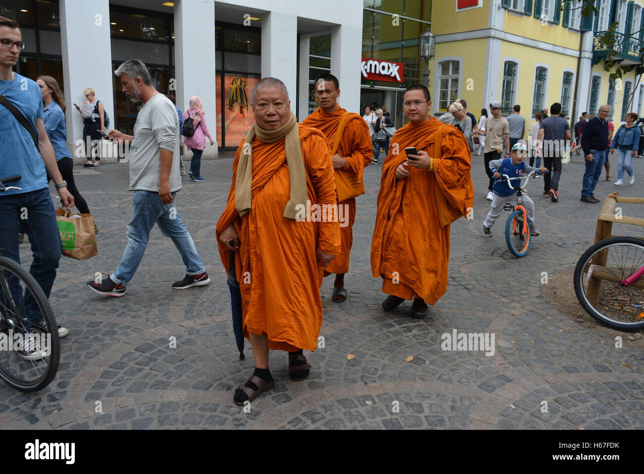 Buddhist monks walk through hi-res stock photography and images - Alamy