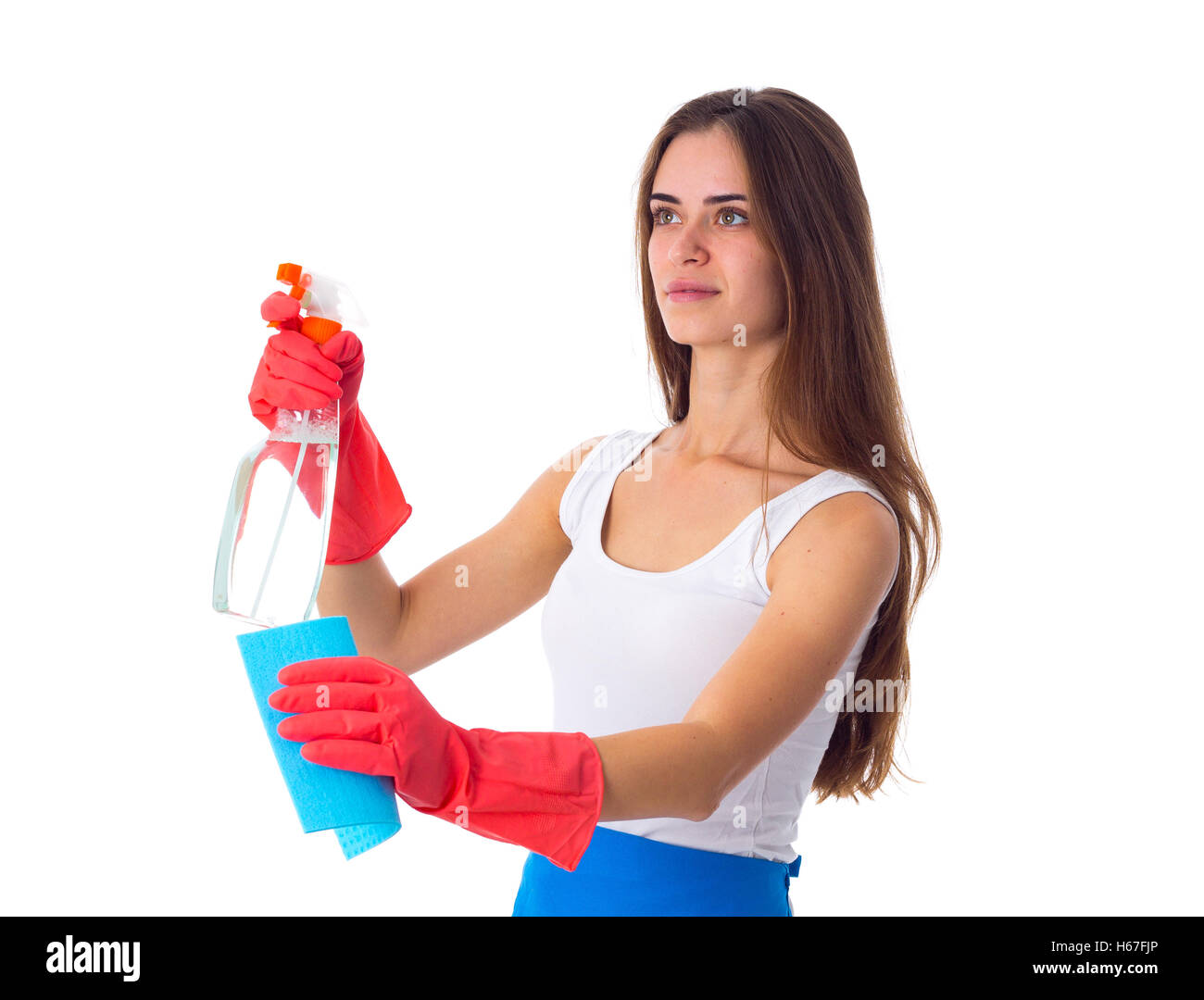 Woman using duster and detergent Stock Photo - Alamy